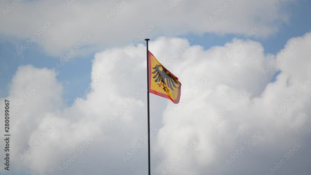 Official flag of the German federal waving in the wind. The flag of the ...