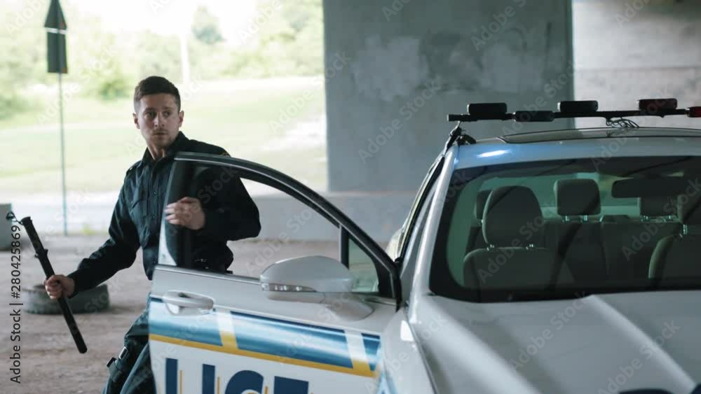 Angry policeman with a pistol punches the offender arrest bad guy crime ...