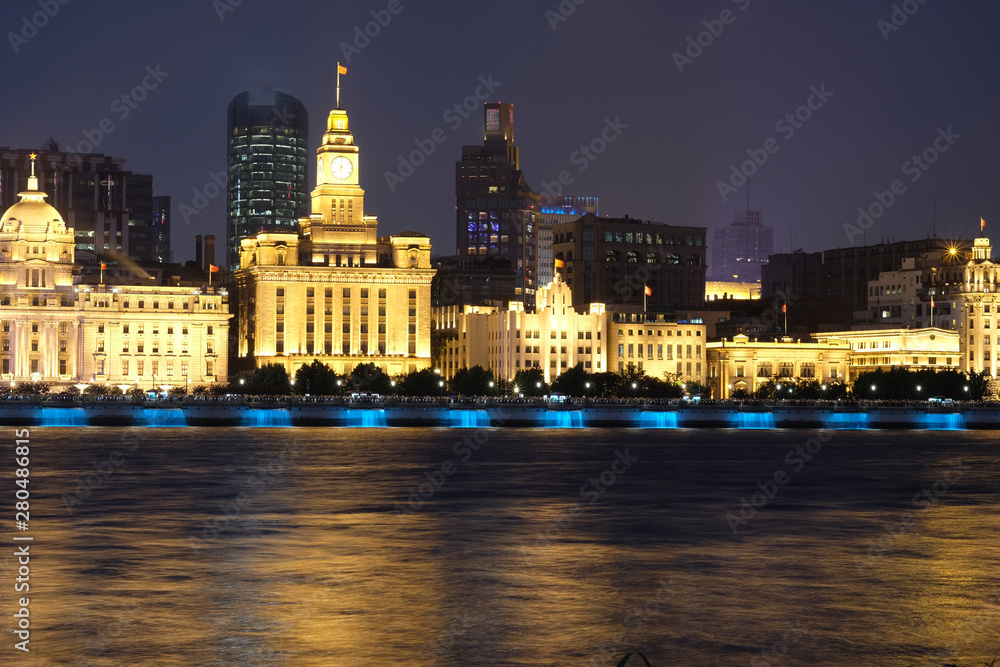 Beautiful evening scene of the bund in Shanghai Puxi. Shining golden ...