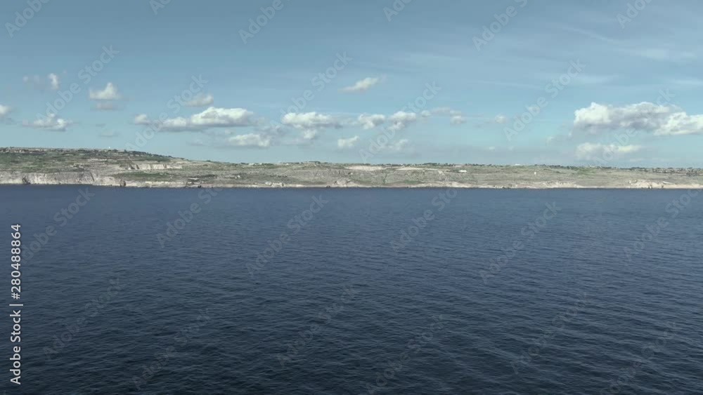 Slow aerial flight over the Mediterranean sea towards the coastal ...