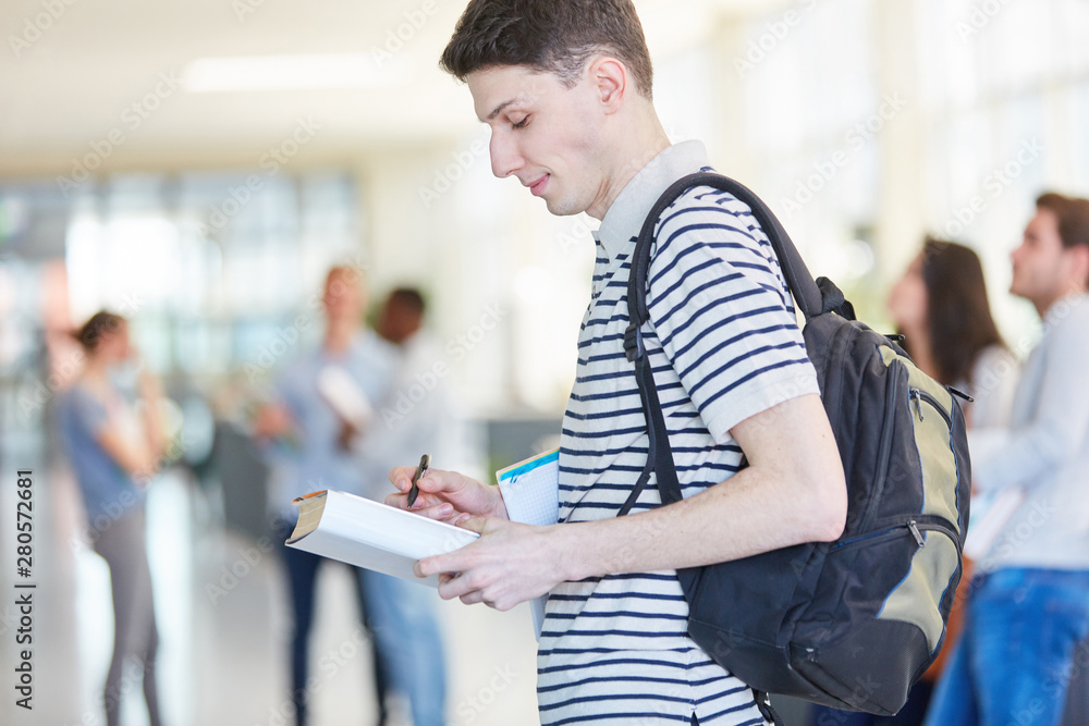 Young man as student of freshman year Stock Photo | Adobe Stock