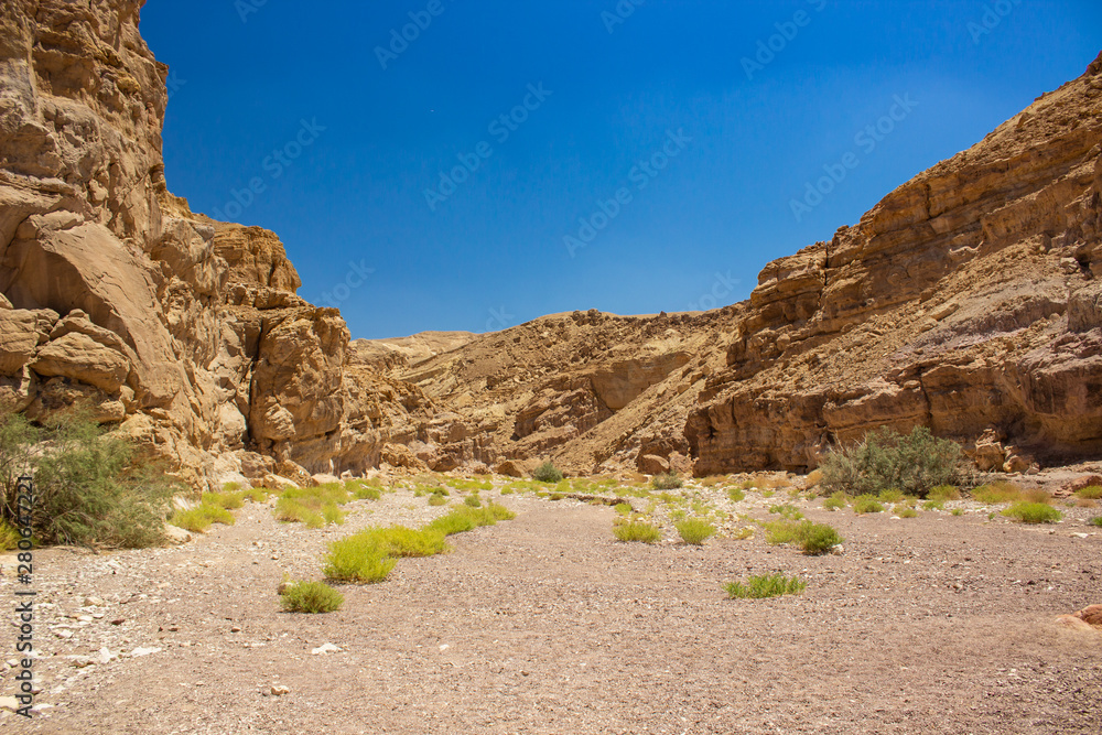 canyon path way between desert bare rocks Israeli national touristic ...
