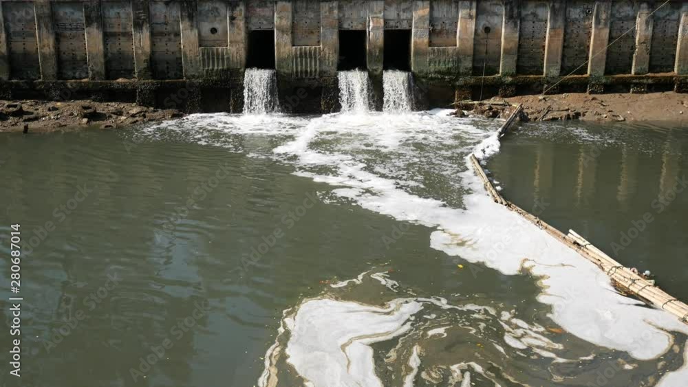 waste water flow to sewer from city,Dirty water flows from a pipe ...