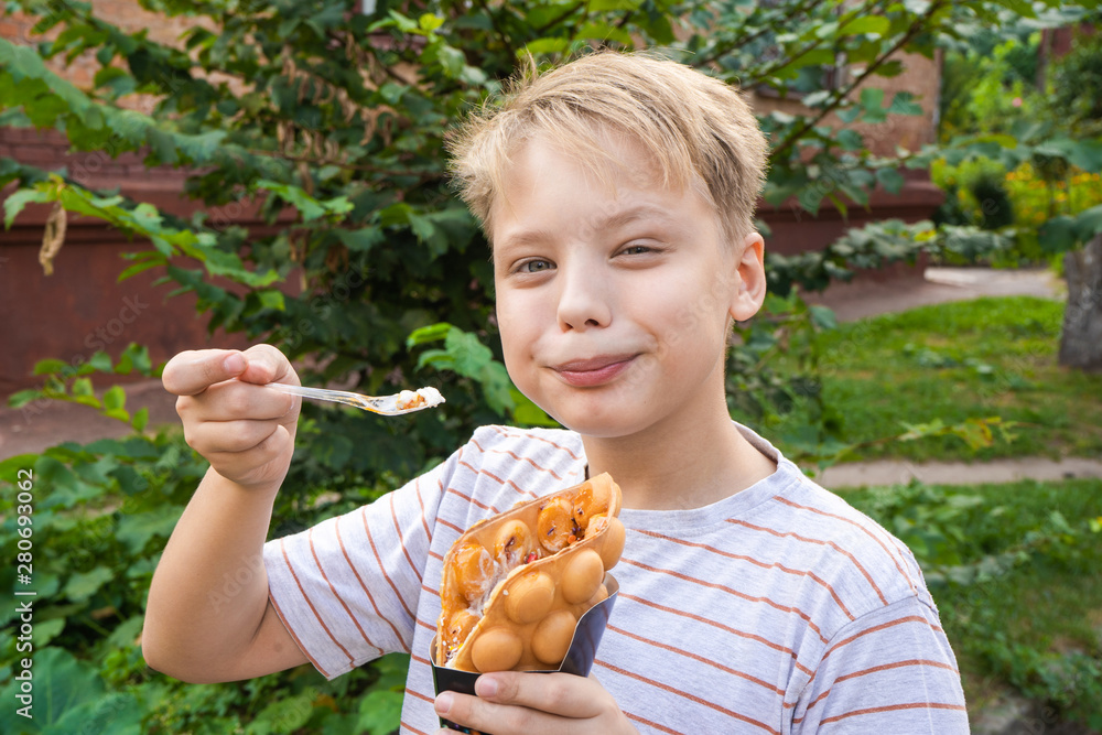 Closeup portrait of healthy happy white kid eating tasty sweets ...