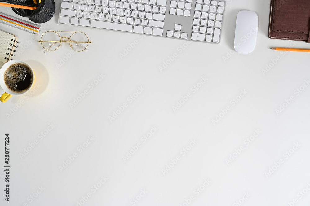 Office desk top view table with computer keyboard, coffee, notebook on ...