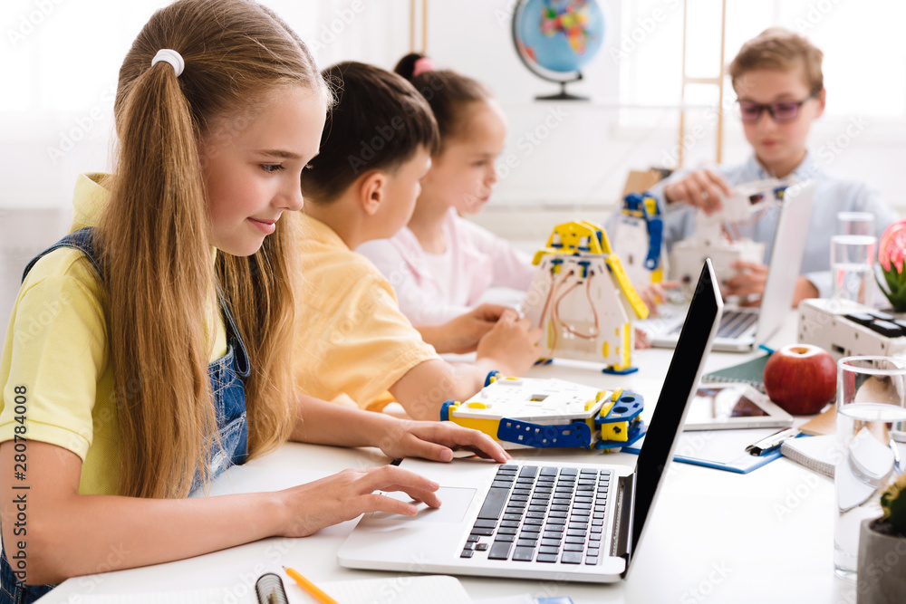 Stem education. Girl programming diy robot with laptop Stock Photo ...