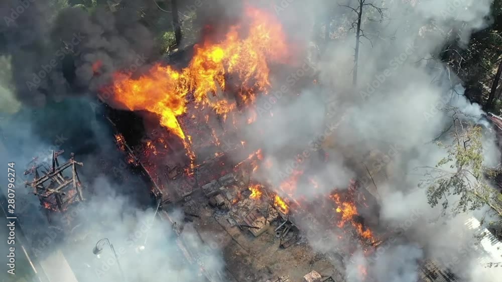 Flames burn as brave firefighters work on a dangerous house and car on ...