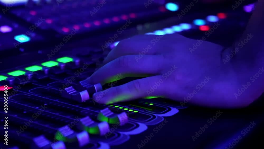 Remote control for adjusting the sound. Audio mixer. Sound engineer ...