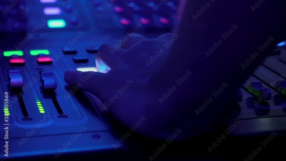 Remote control for adjusting the sound. Audio mixer. Sound engineer ...