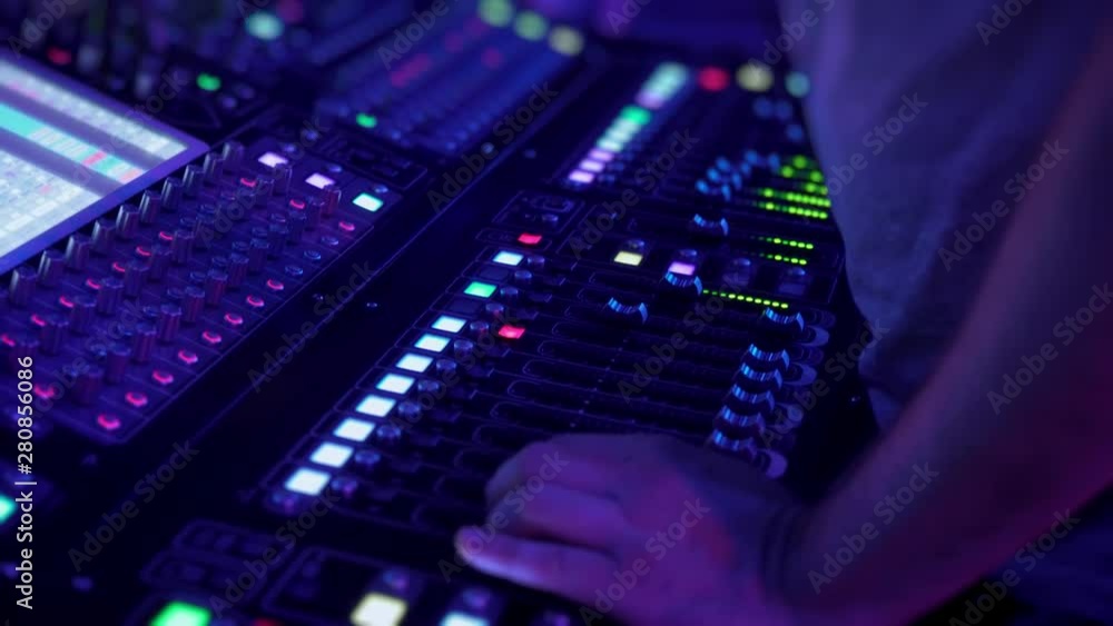 Remote control for adjusting the sound. Audio mixer. Sound engineer ...