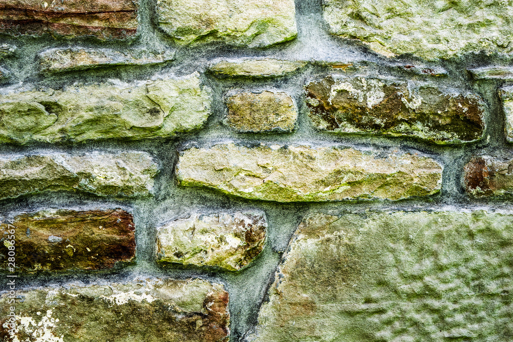 texture of masonry, a fragment of a stone wall of an ancient temple of ...