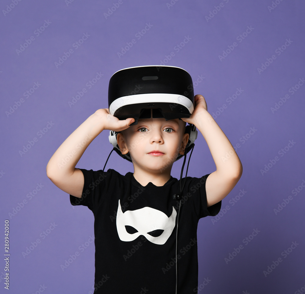 Young boy kid child play virtual reality game wear vr glasses and ...