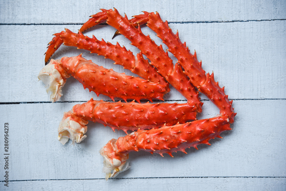 Crab Legs on wood background - Alaskan King crab hokkaido seafood Stock ...