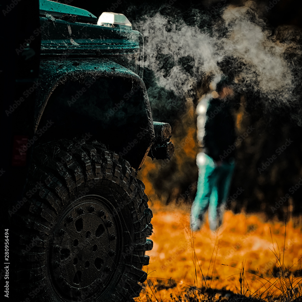 Drag racing car burns rubber. Extreme. Off-road car. Motion the wheels ...