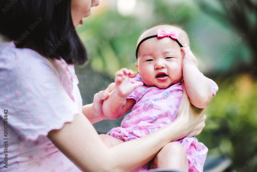 Asian baby happy in the graden.Asian baby girl happy family time. Stock ...
