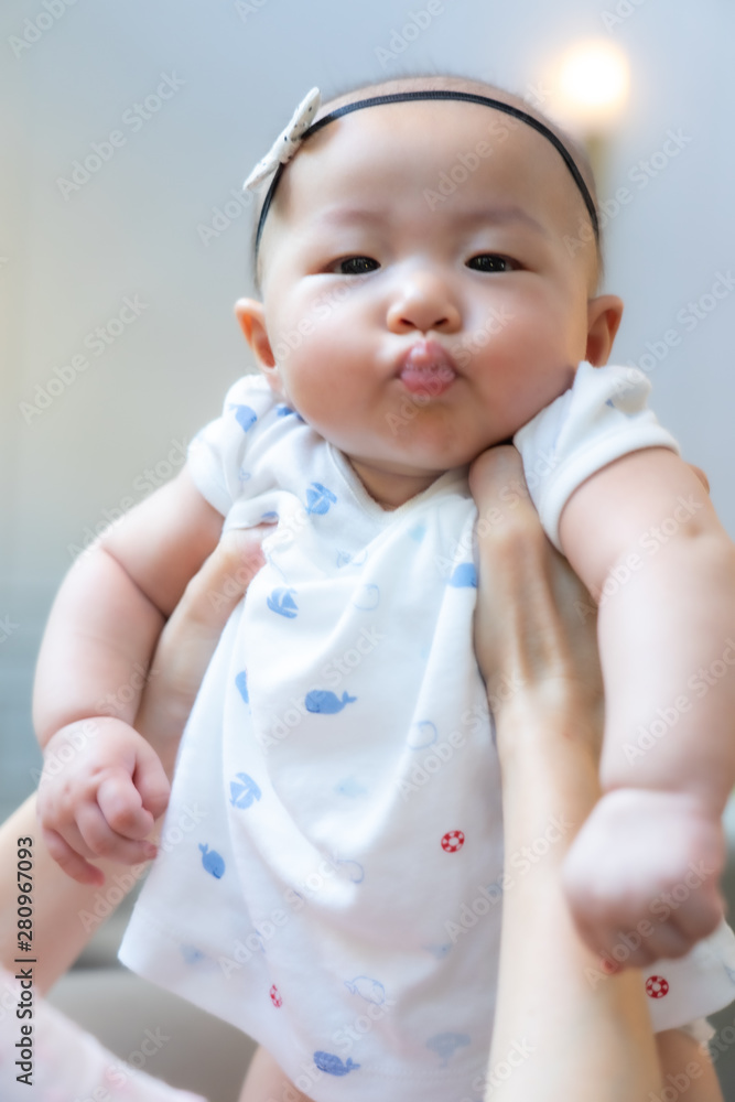 Asian baby happy in the graden.Asian baby girl happy family time. Stock Photo | Adobe Stock
