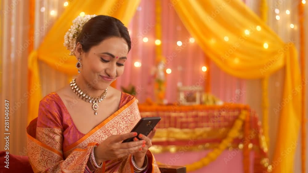 Happy Indian woman thinking and texting a friend or husband - Festival ...