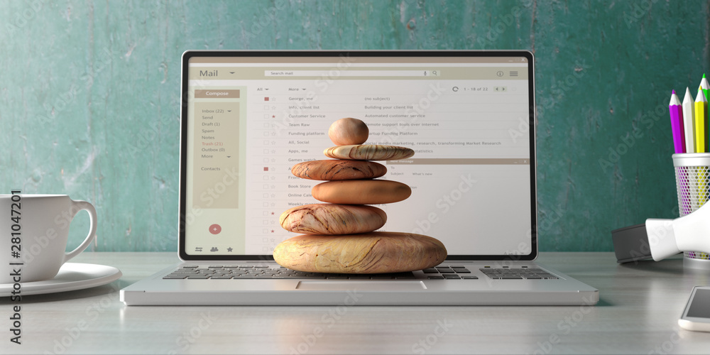 Zen stones stack on a computer laptop office desk background. 3d ...
