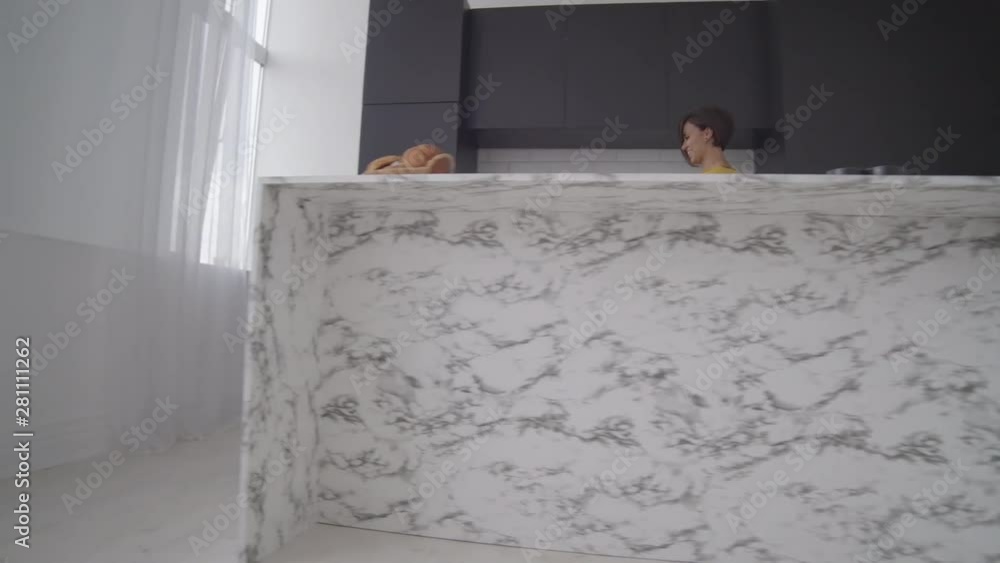 Mother and baby son playing tag running through the house and laughing ...