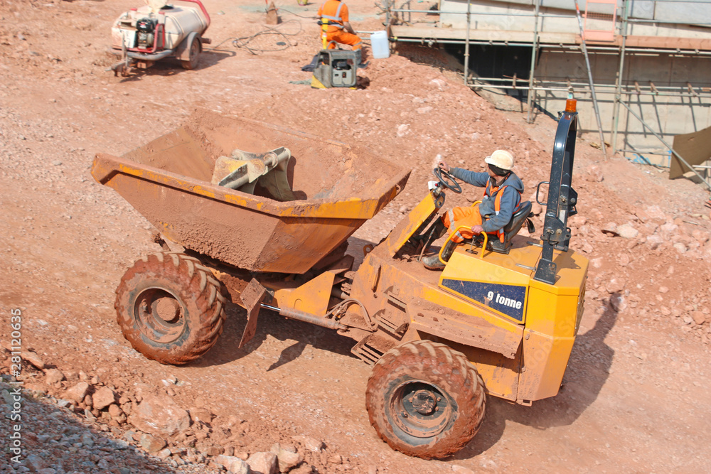 Dump truck on a road construction site Stock Photo | Adobe Stock