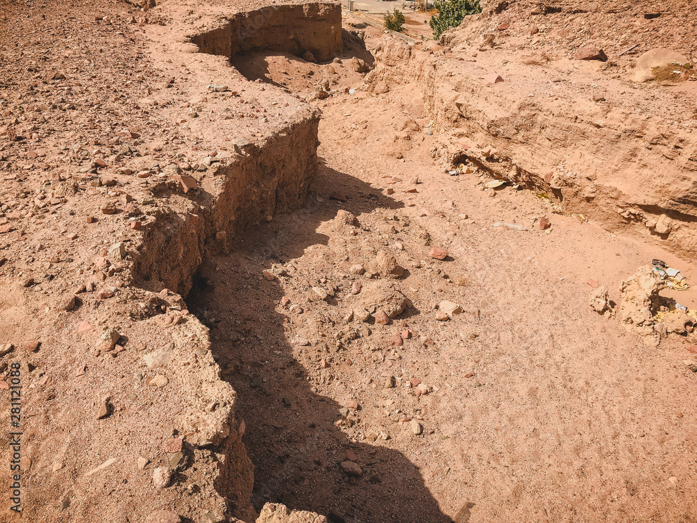 Water erosion formed wash (ravine) and approaching rain storm in Death ...