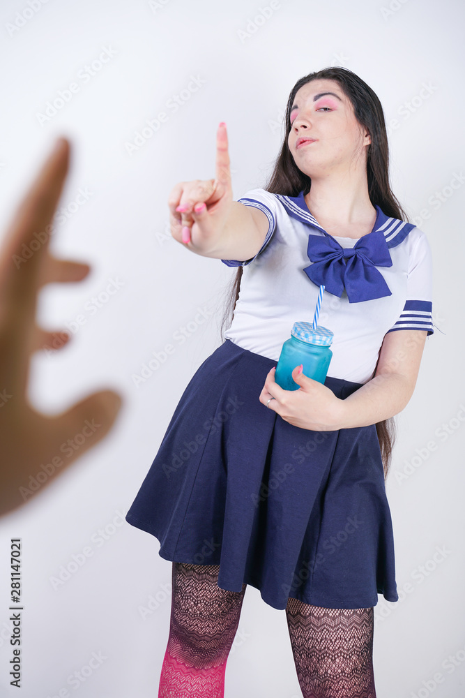 scared girl in school anime uniform on white background in Studio Stock ...