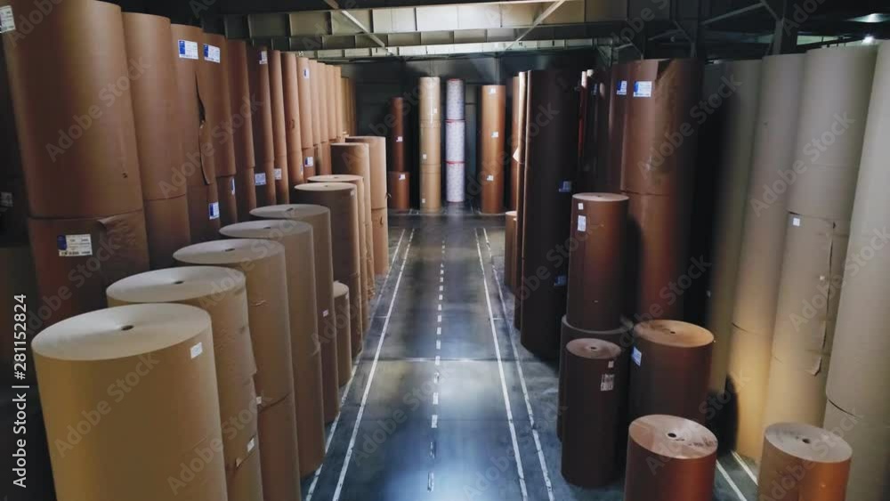 motion along aisle between packaging paper rolls in storage Stock Video ...