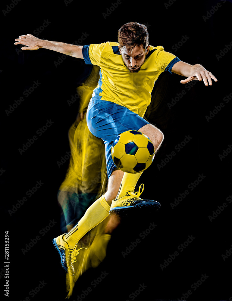 one caucasian soccer player man isolated on black background with light ...