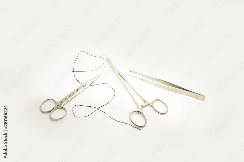 Medical instruments Surgical suture with Forceps and scissor on white ...