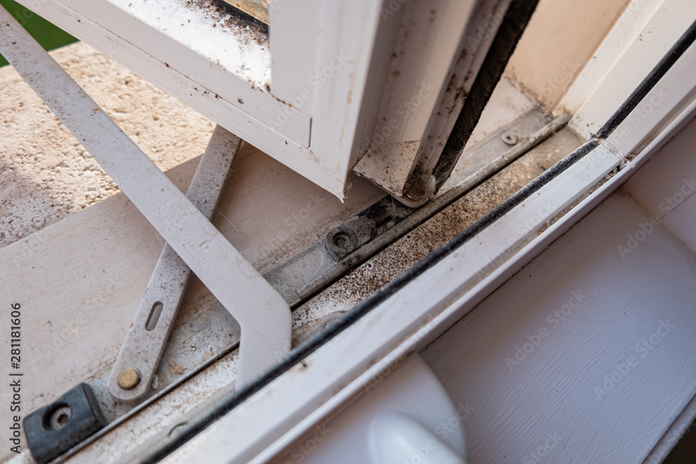 A dirty, moldy window before being cleaned. Stock Photo | Adobe Stock
