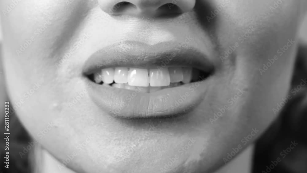 Stockvideon Crop of lightly opened female full lips with lipstick on ...