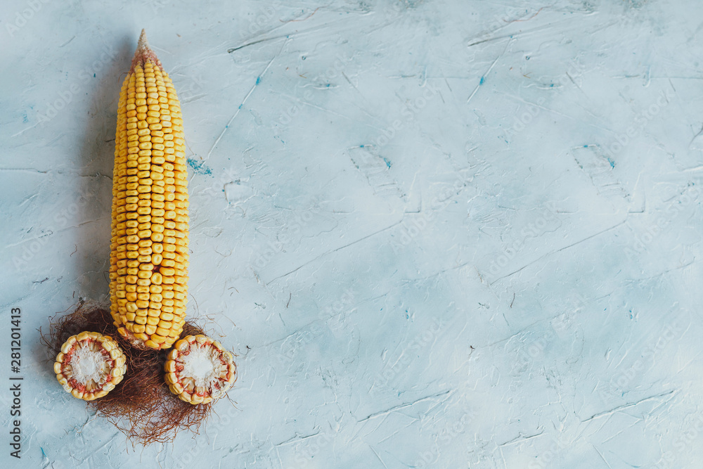 Big sweet corn and two corn cuts as a symbol of Men's sexual organs ...