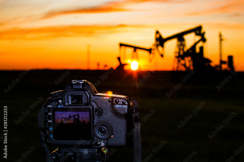 The screen of the camera. Pumping unit is working in oil field of the ...