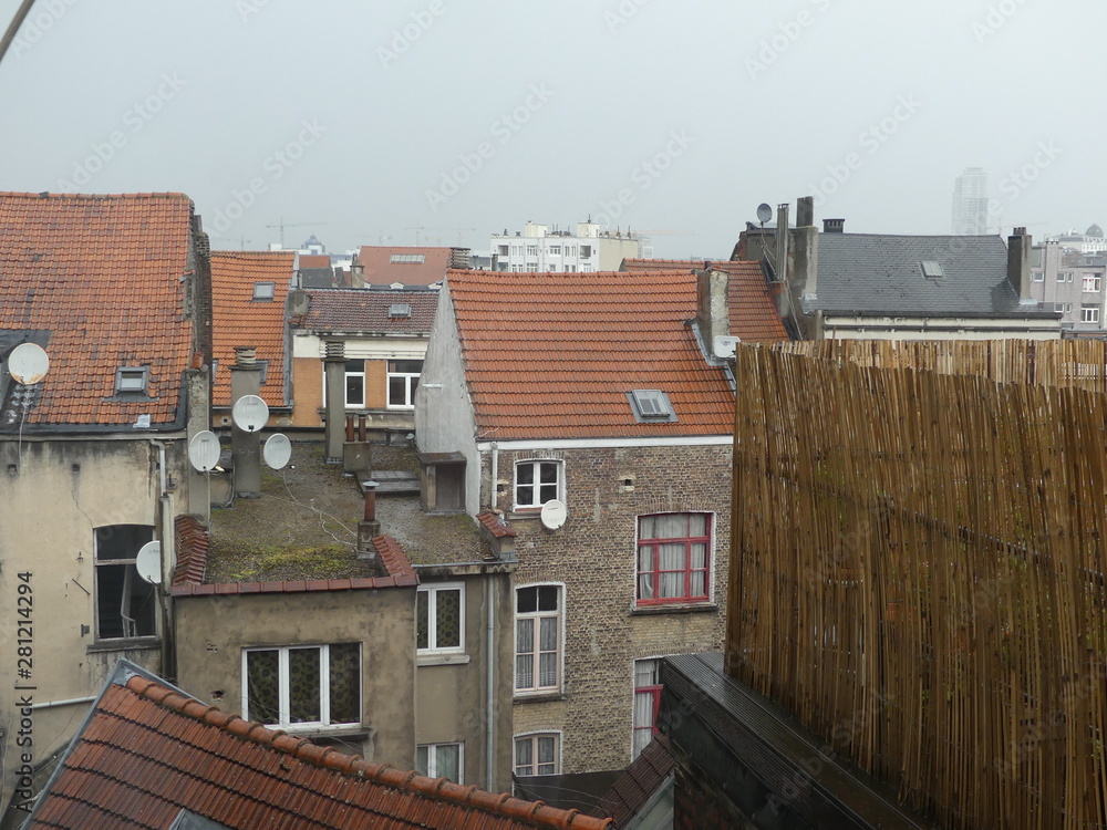 Old rooftops. Old windows. Roof terrace. Satellite dishes on the ...