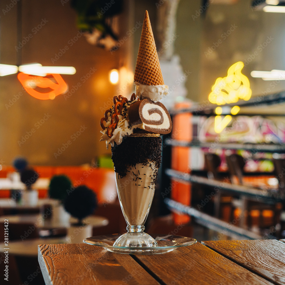 Chocolate freak shake with ice cream, brezel, cake and whipped cream ...
