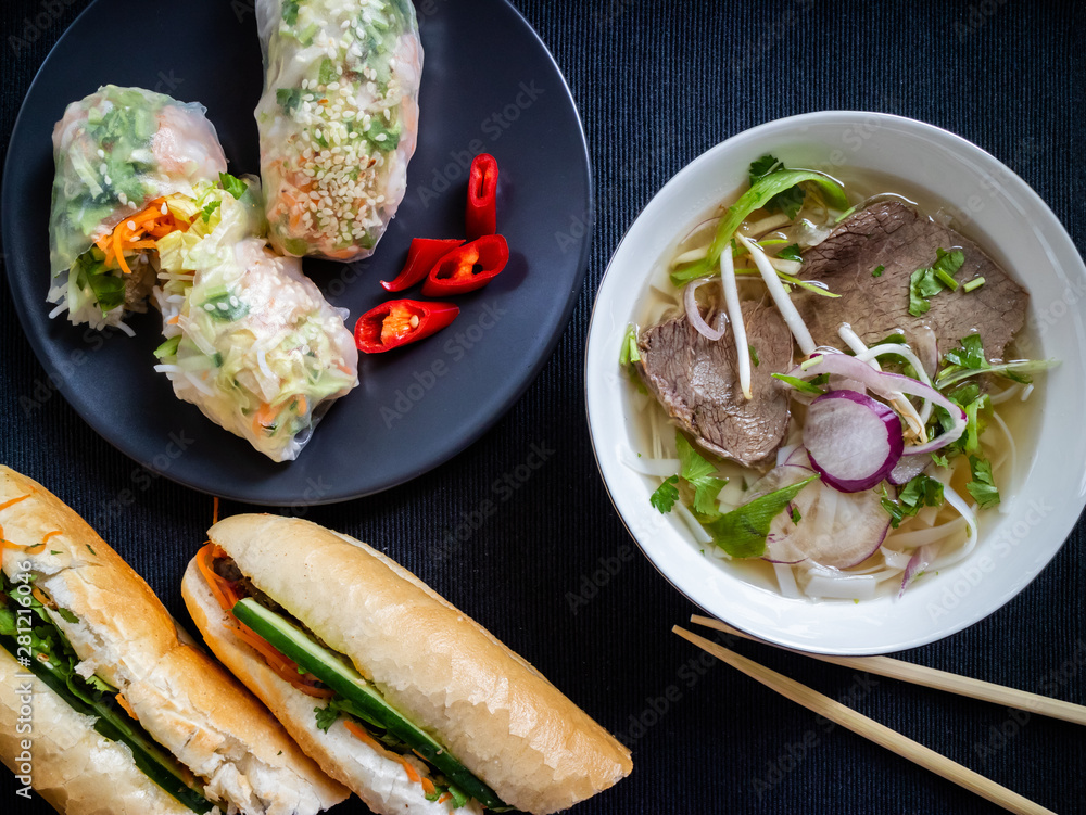 Traditional food from Vietnam pho bo, banh mi bo and nem song Stock ...