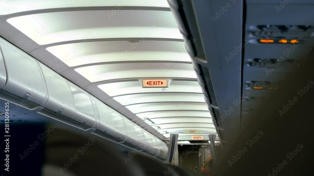 The interior of the aircraft. Rows of seats on the plane with ...