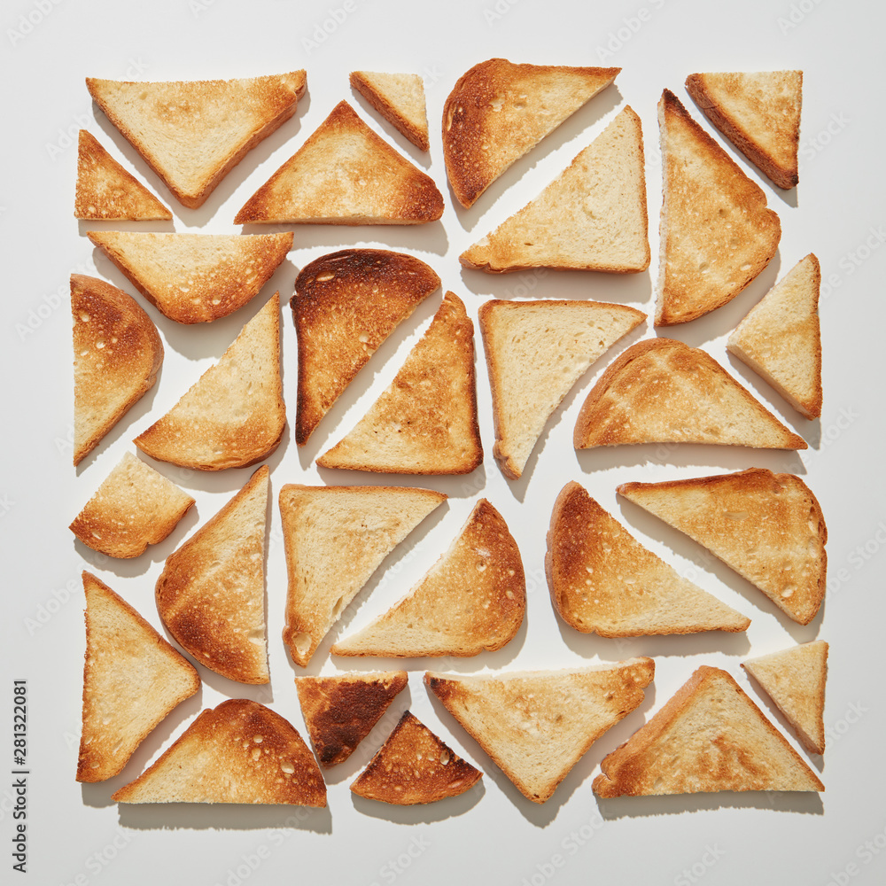 Pattern in the form of a square from different pieces of fried toast on ...