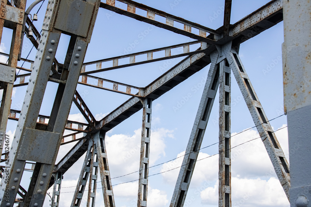 Metal beams on the sky with clouds background Stock Photo | Adobe Stock