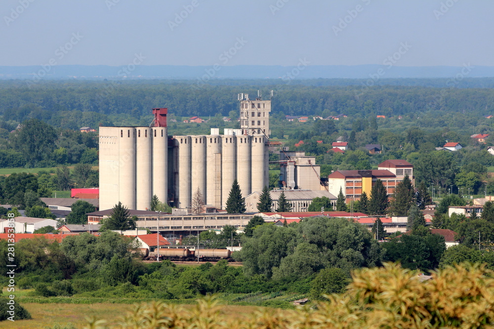 Tall concrete storage silos made as one large building at local ...