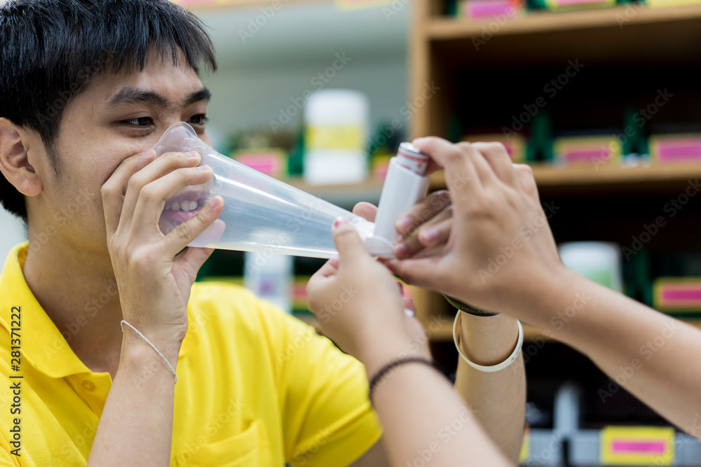 Man training to use inhaler medicine or Albuterol lung with plastic ...