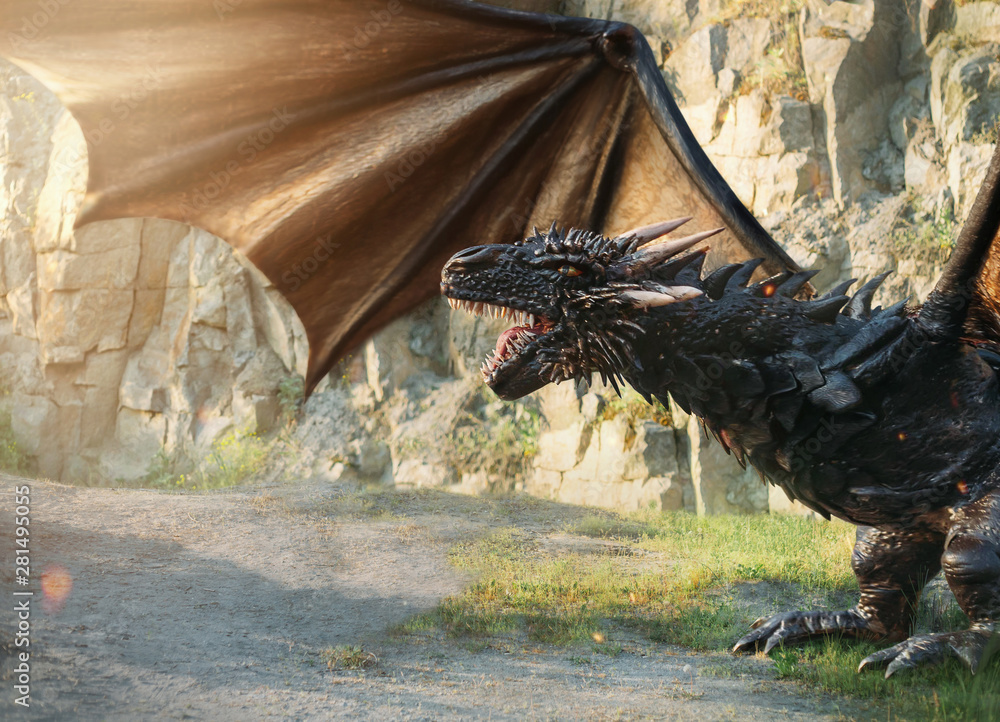 Huge aggressive mystical dragon in move. Creature with big strong wings ...