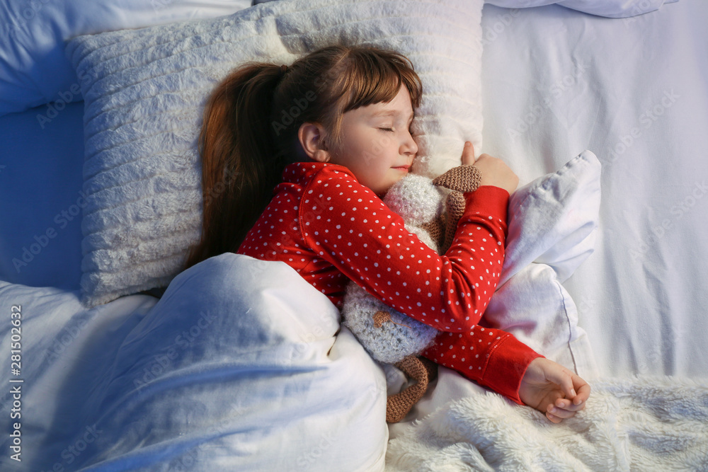 Cute little girl sleeping in bed at night Stock Photo | Adobe Stock