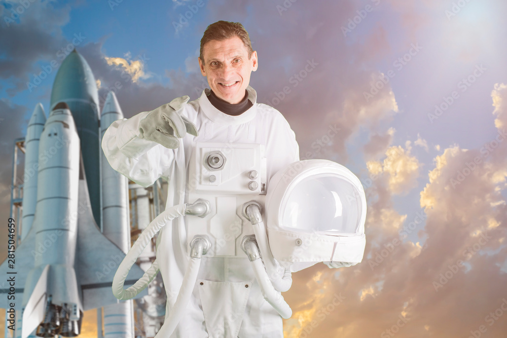 astronaut holding helmet space suit and smiling Stock Photo | Adobe Stock