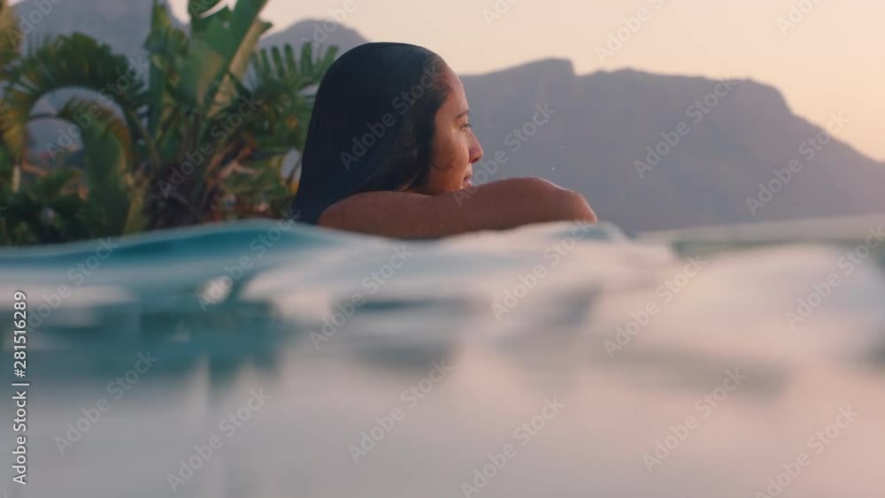 woman relaxing in swimming pool at luxury hotel spa enjoying relaxation ...