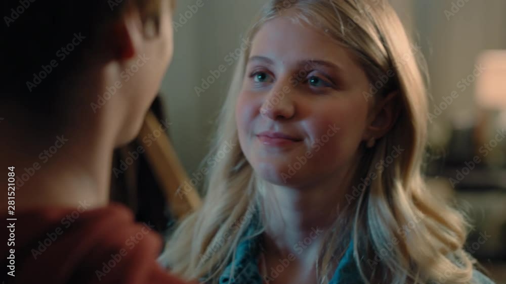 happy teenage couple first kiss girl kissing boyfriend at home after ...