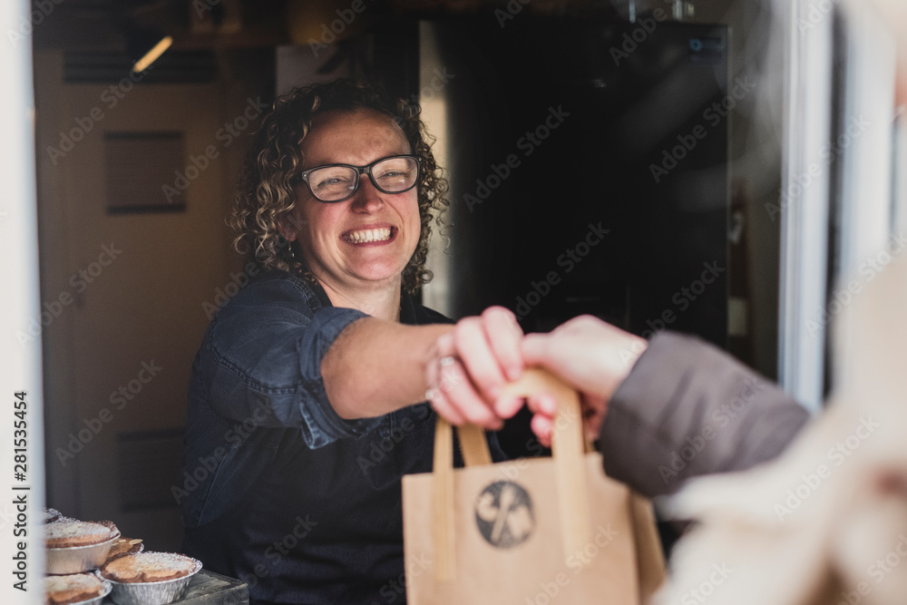 Woman Handing Shopping Bags