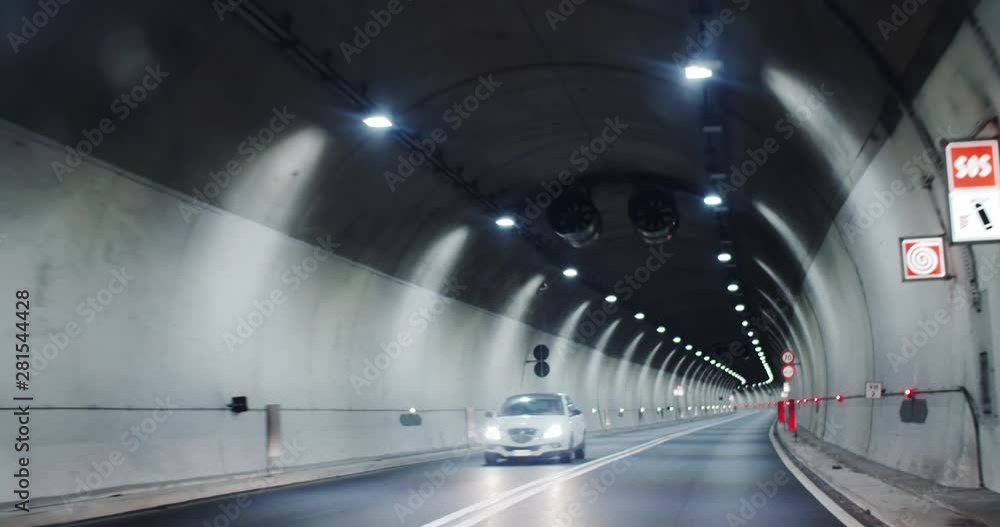 tunnel road drive. subjective view of the fast modern car driving fast ...
