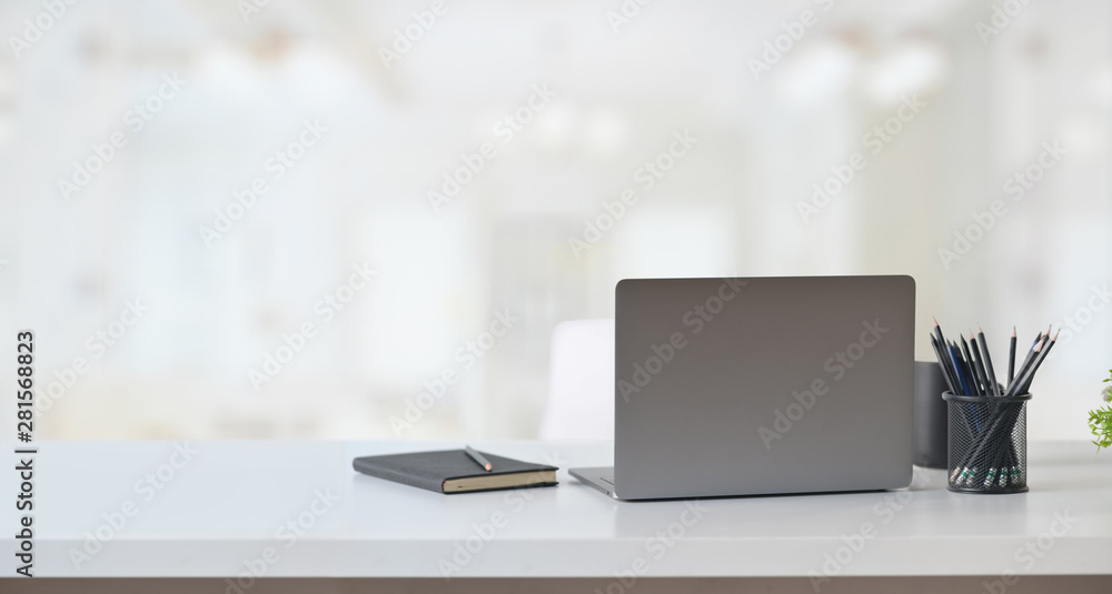 Laptop computer on table in office workspace. Stock Photo | Adobe Stock