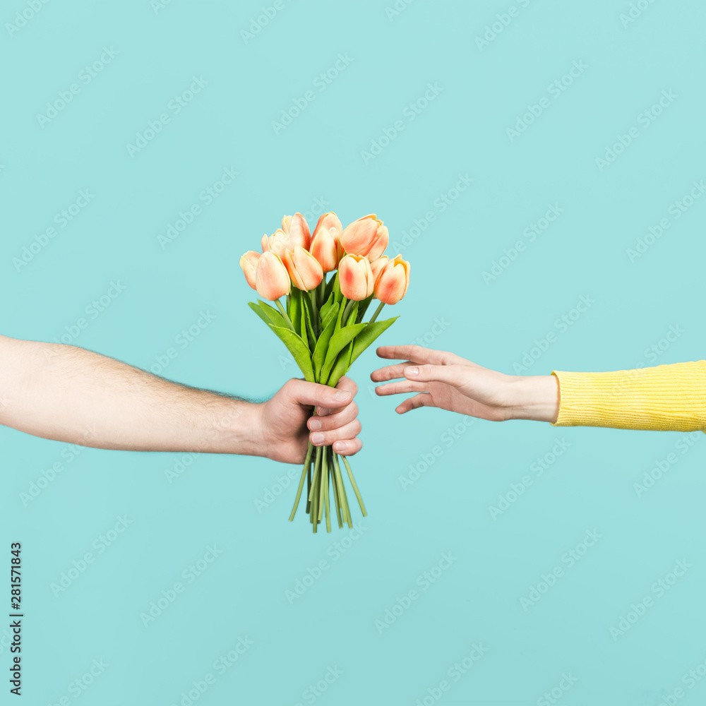 Hand offering flower bouquet Stock Photo | Adobe Stock